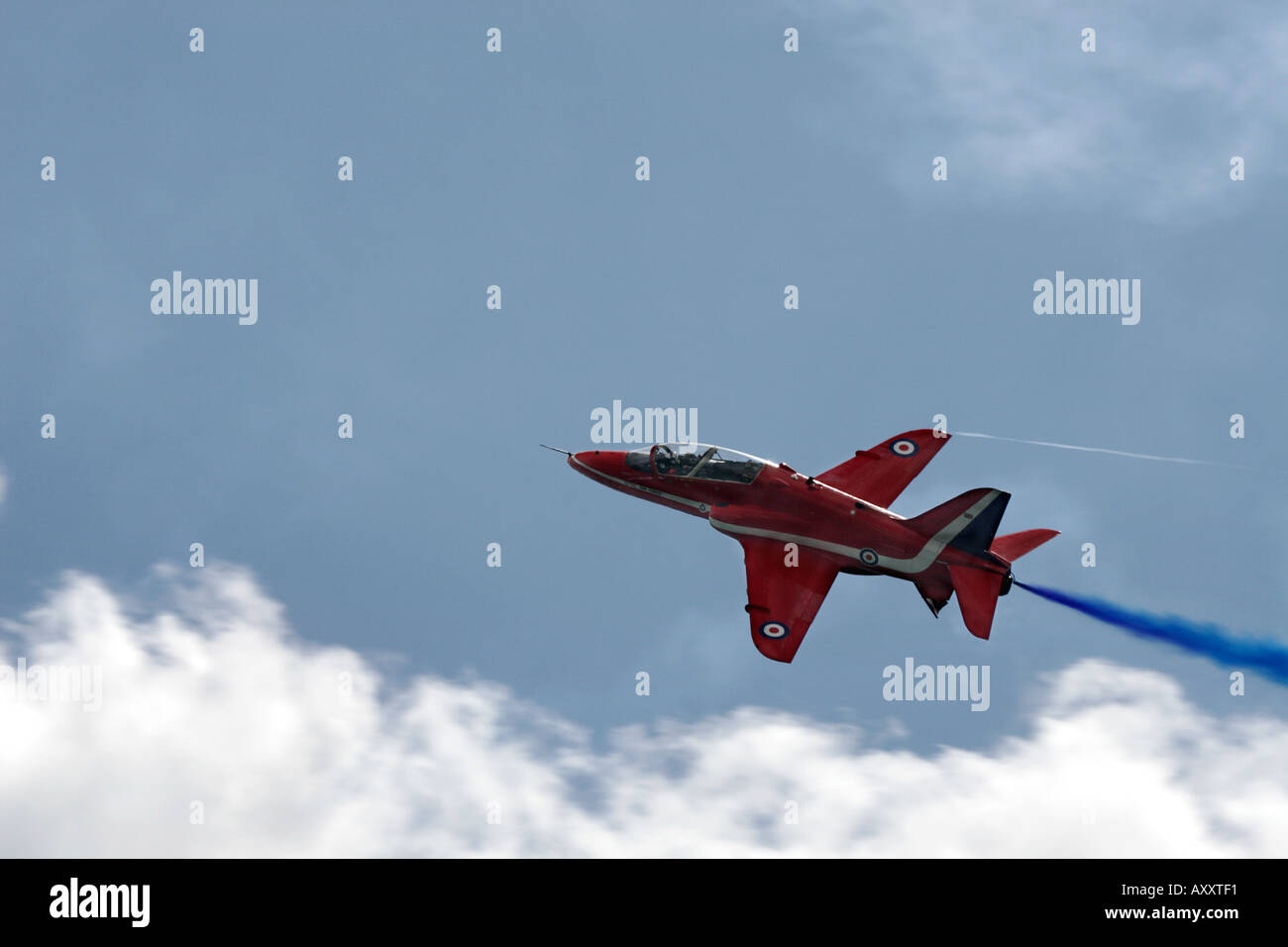 Single jet in Red Arrows display Stock Photo - Alamy
