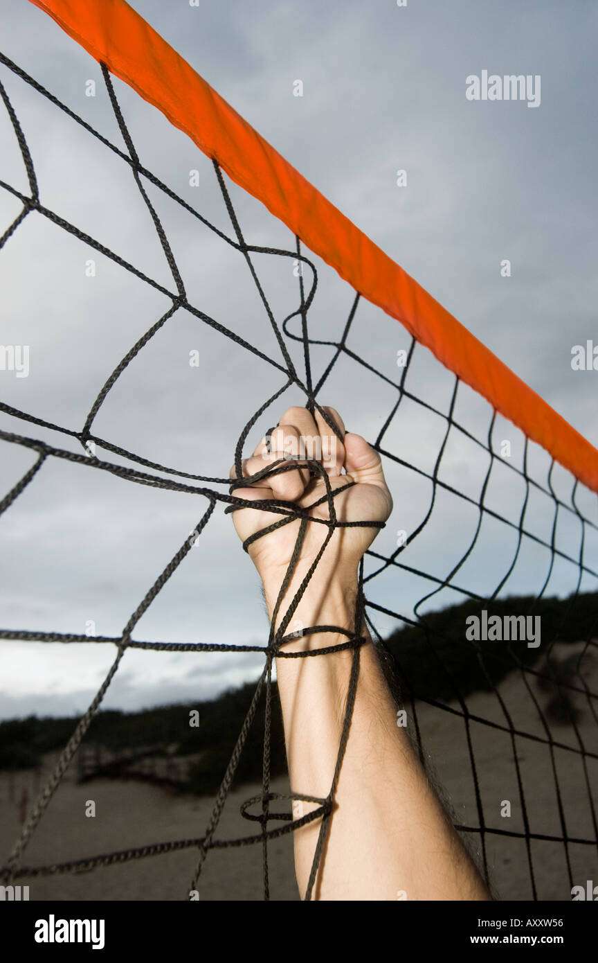 hand grasping at net Stock Photo - Alamy