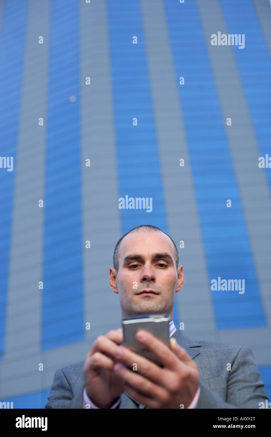 Businessman using a palmtop Stock Photo - Alamy
