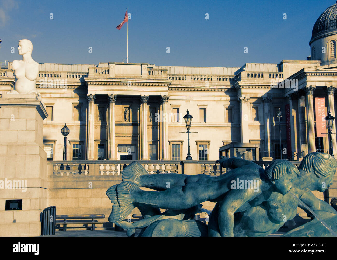 Statues in Trafalgar Square with the National Gallery in the background ...