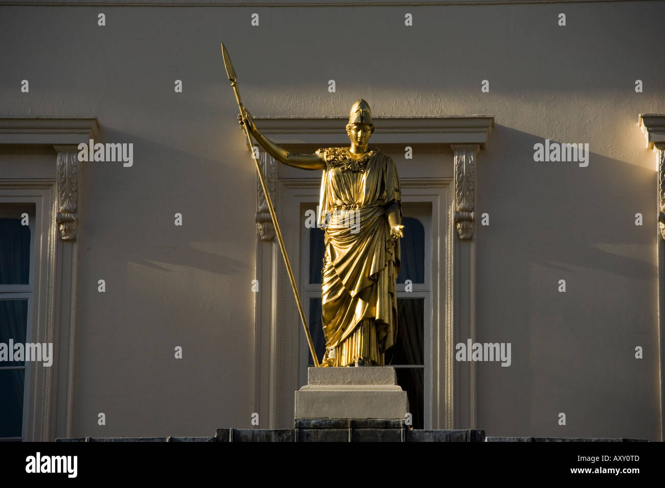 Gold statue on building facade at Waterloo Place in the centre of ...