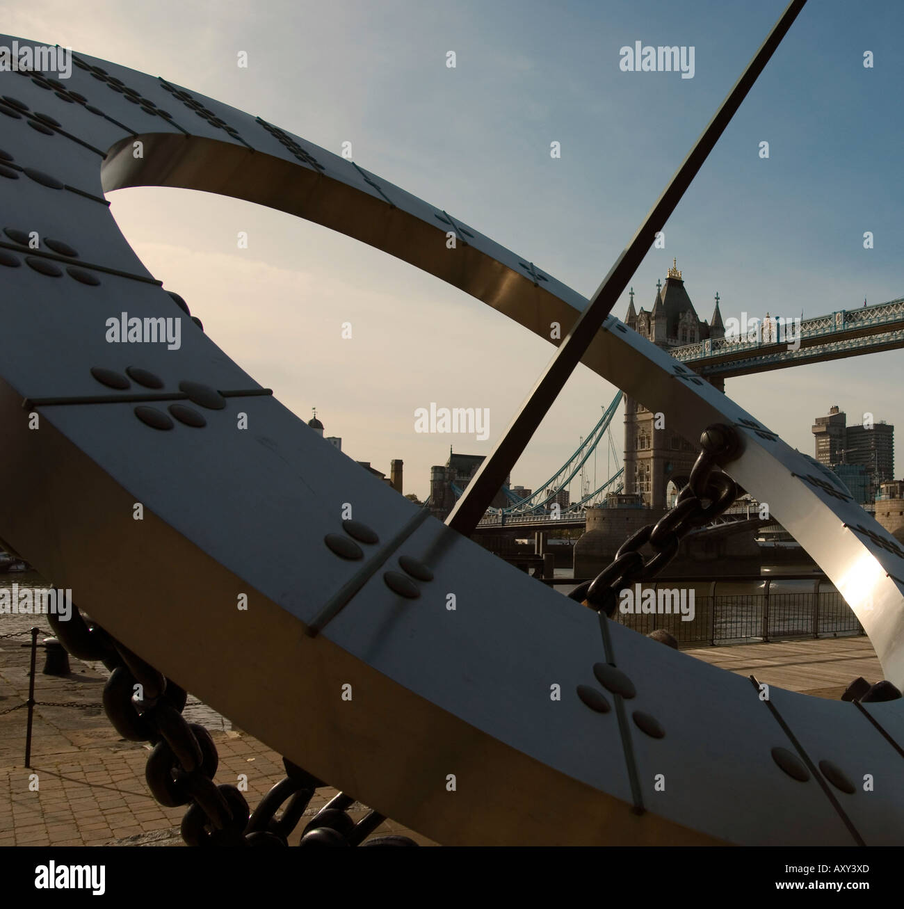 Sundial sculpture at St Katherines Dock with Tower Bridge in the ...