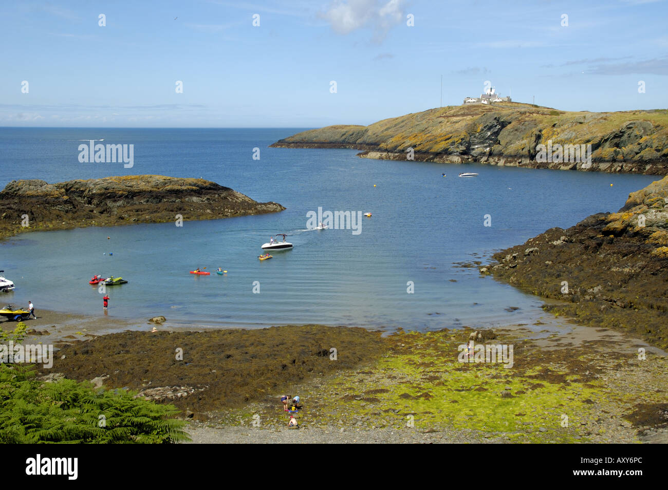 Porth Eilian cove and Point Lynas lighthouse Anglesey North Wales Stock ...