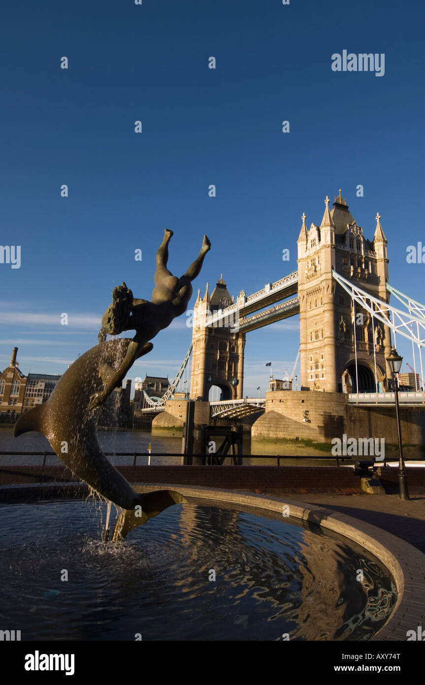 Tower Bridge and Girl with a Dolphin statue, River Thames, London ...