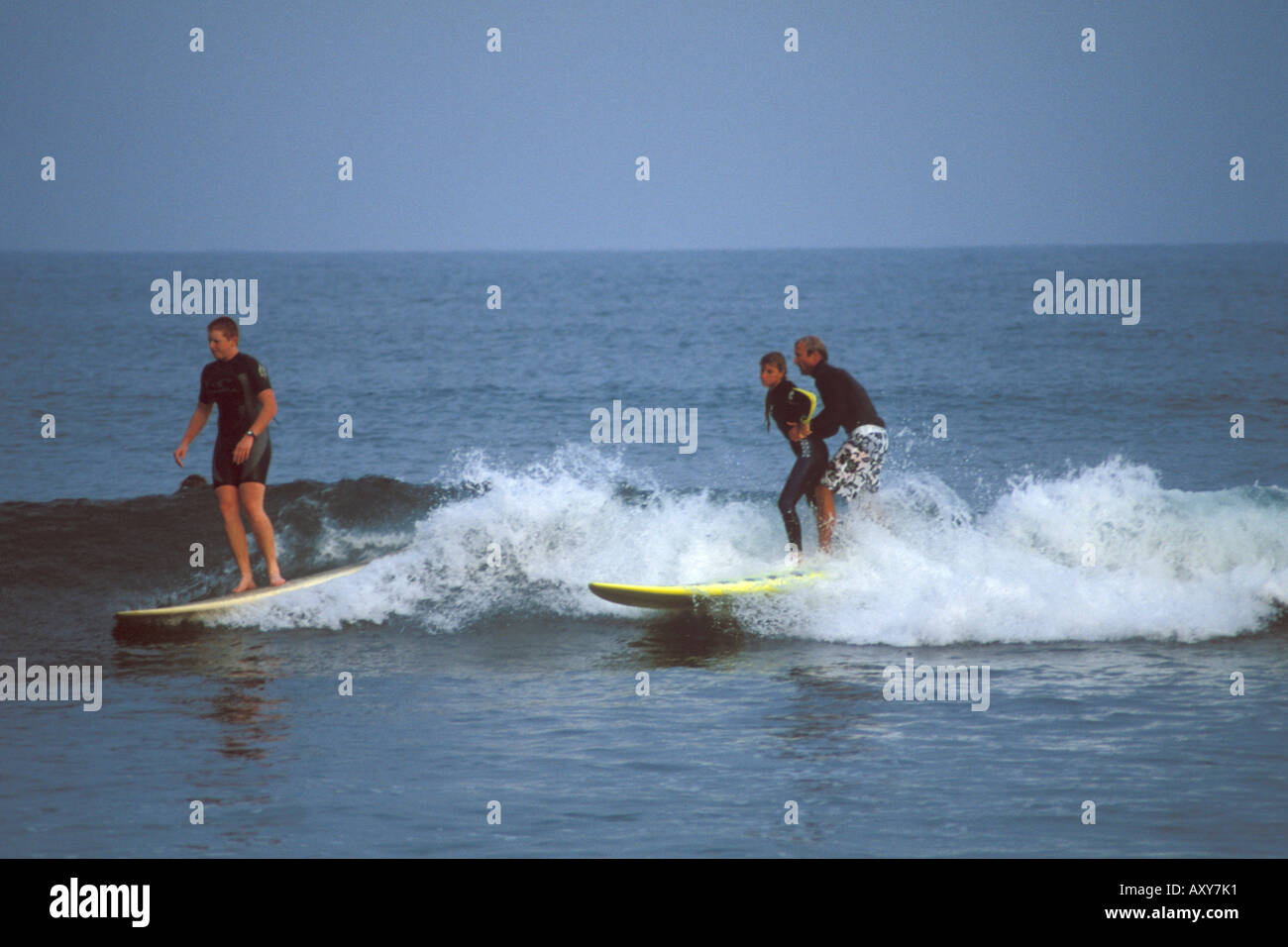 Tandem Surfers riding surfboard on waves at Surfrider Beach State Park ...