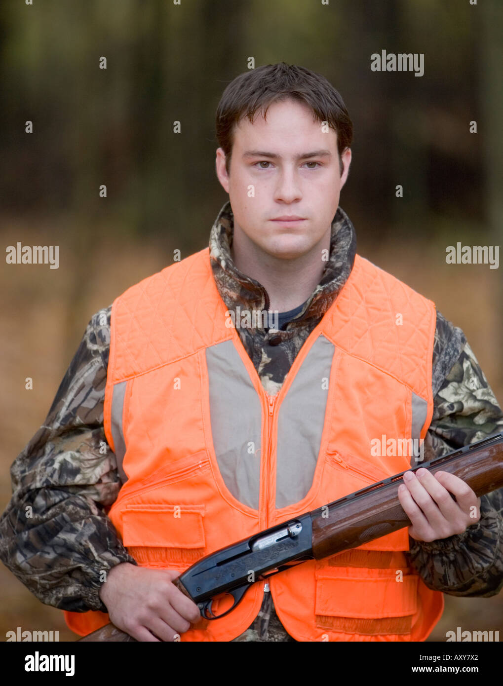 Hunter holding his rifle Stock Photo - Alamy