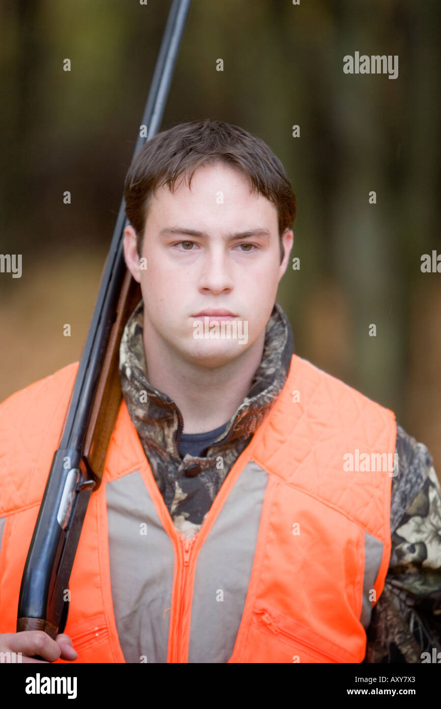 Hunter and his rifle Stock Photo - Alamy