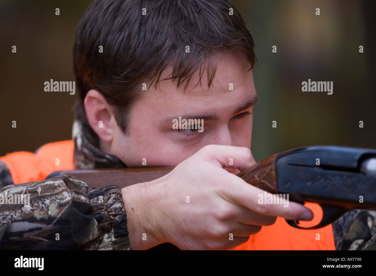 Hunter aiming a shotgun Stock Photo - Alamy