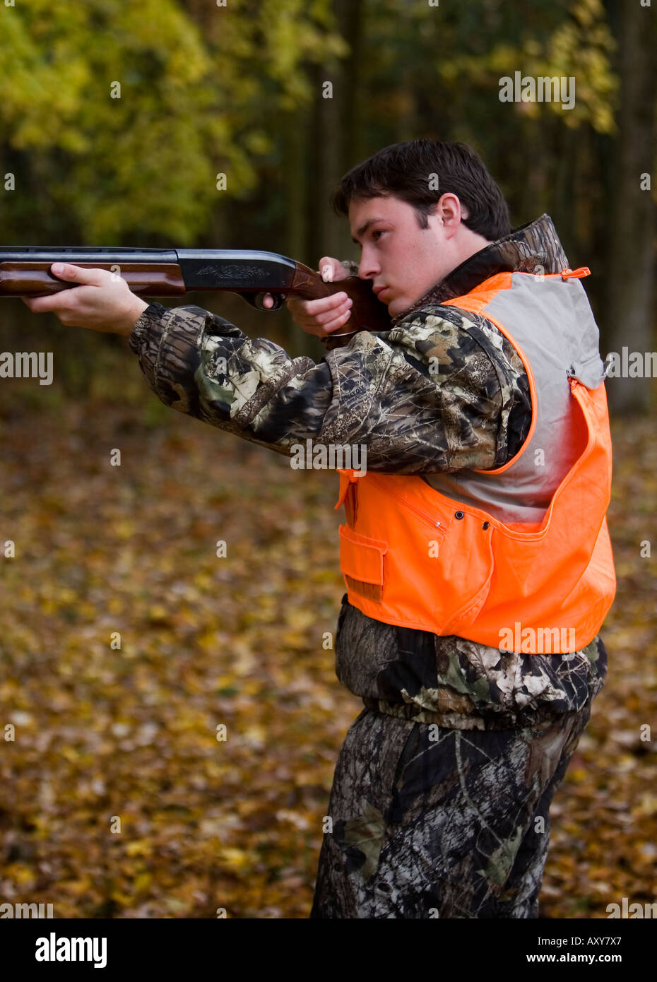 Hunter aiming a shotgun Stock Photo - Alamy