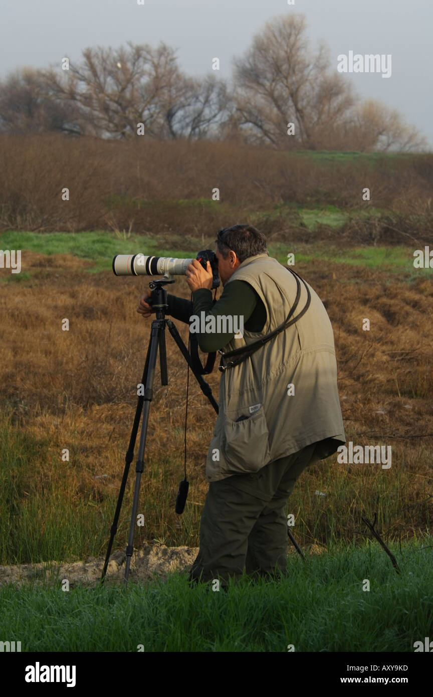 Photographer photographing riparian habitats in the Merced National ...