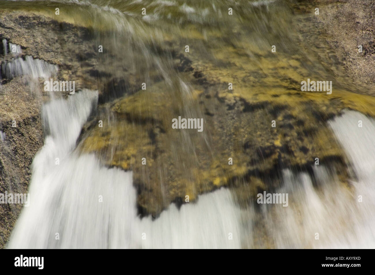 Detail close up of water flowing off rocks in Cascade Creek during ...