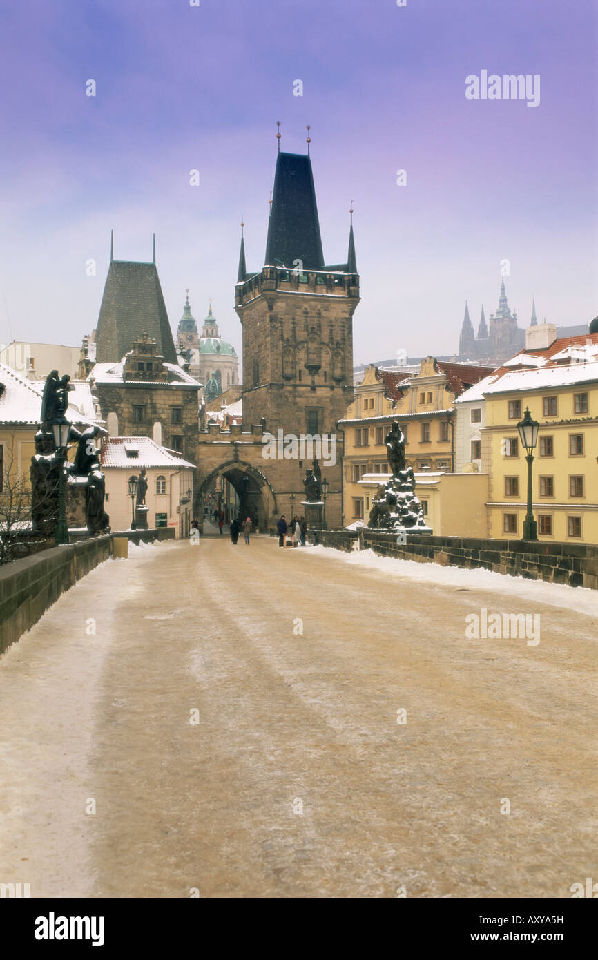 Charles Bridge and St. Vitus cathedral in winter snow, Prague, UNESCO ...