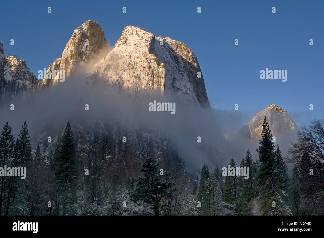 Morning light and clearing spring storm clouds on Cathedral Rock Yosemite Valley Yosemite ...