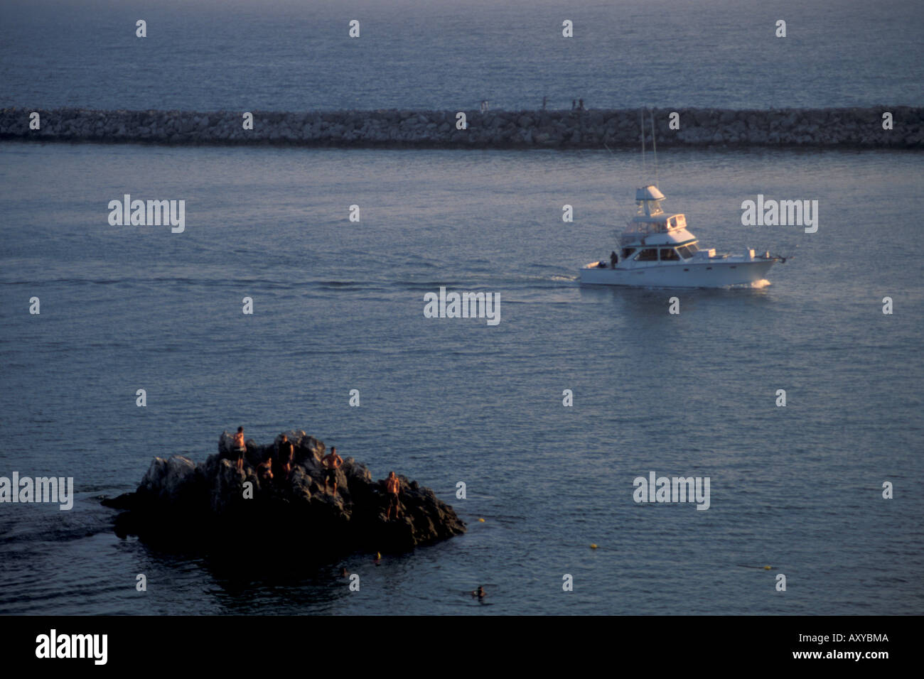 Yacht returning to harbor port in calm sea water channel Newport Beach ...
