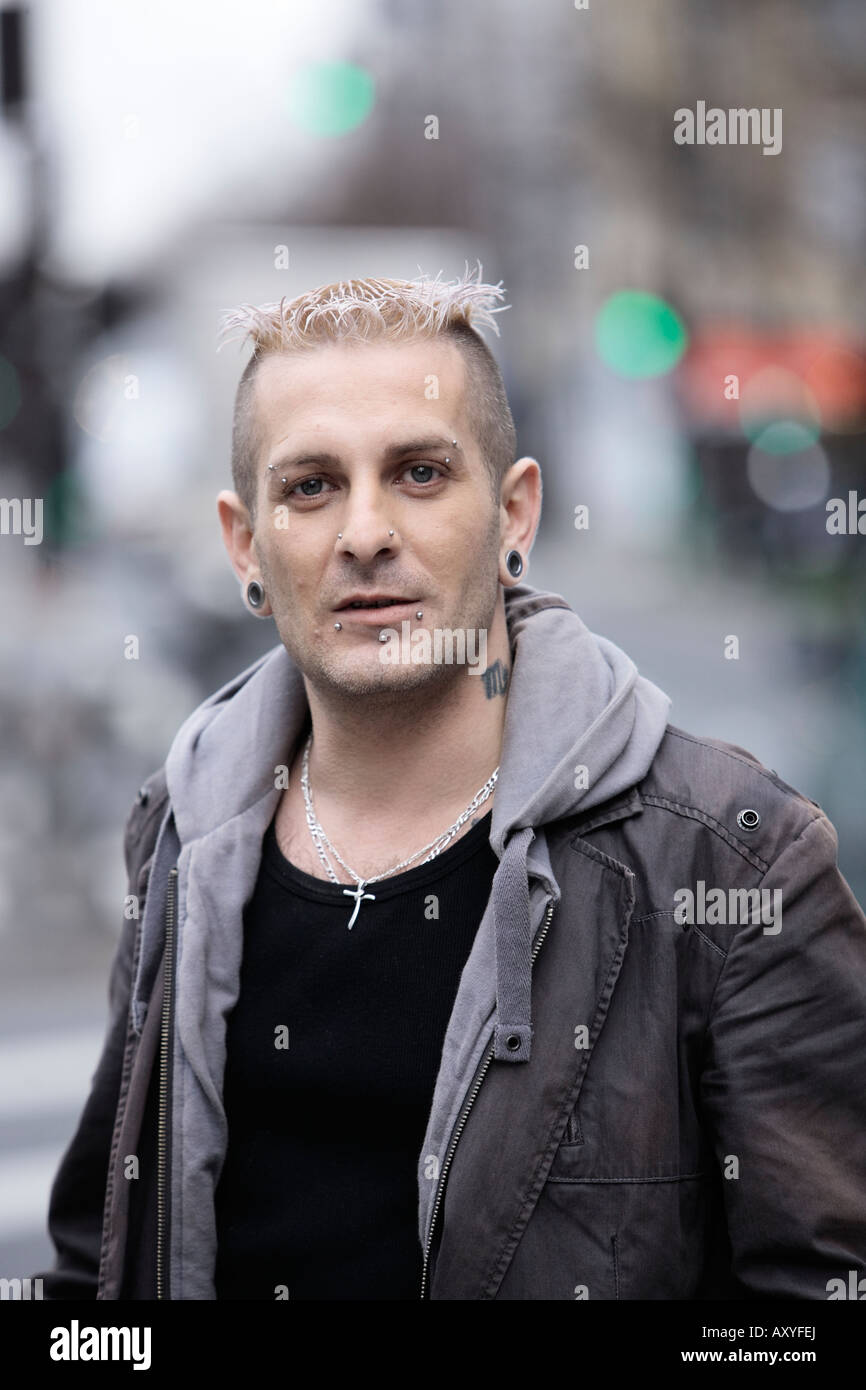 portrait of a caucasian man with piercing and tattoos Stock Photo - Alamy