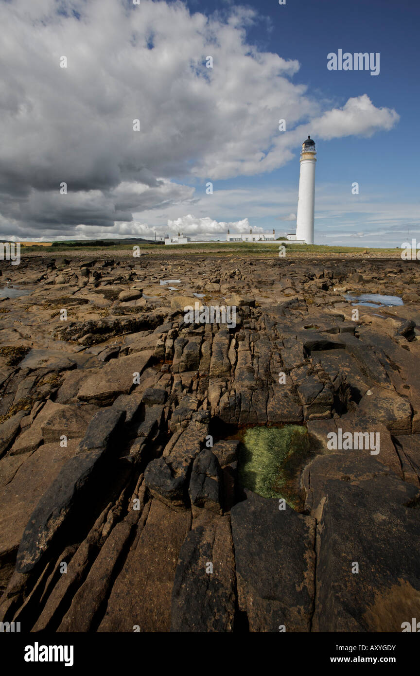 Rocky coastline of East Lothian, Scotland, with Barns Ness lighthouse ...