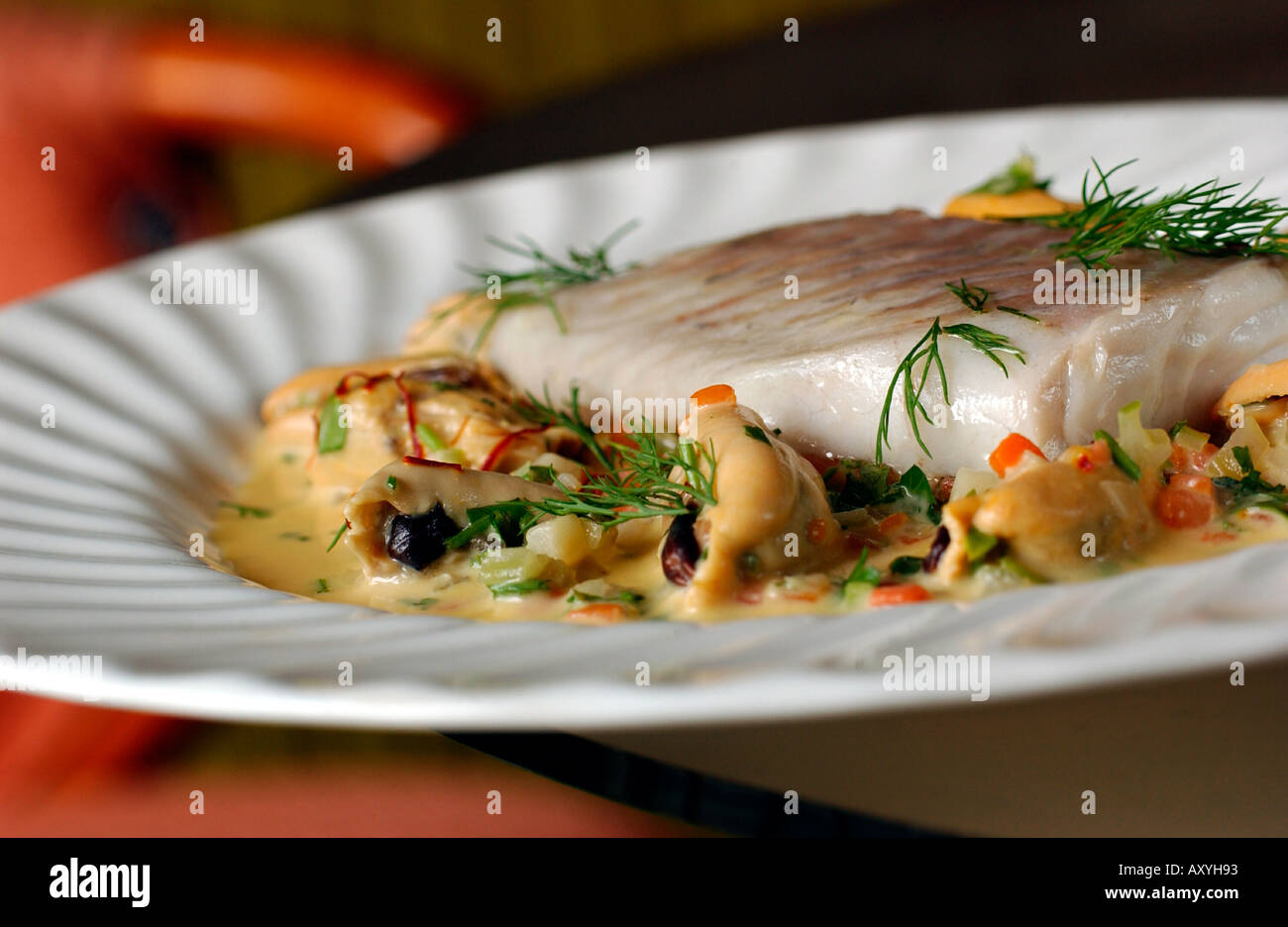 Cod with mussel sauce Stock Photo - Alamy