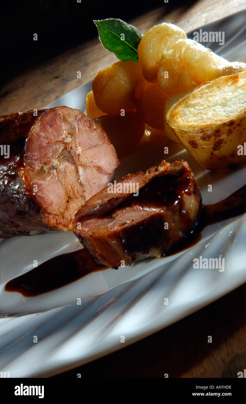 Roast wild boar with onions Stock Photo - Alamy