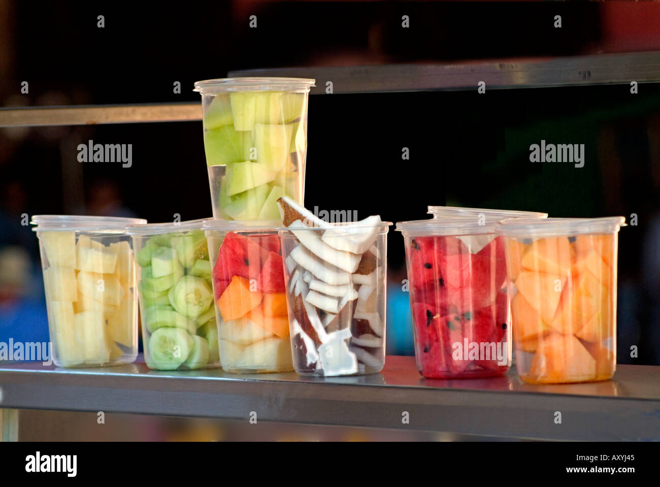 Clear plastic cups of fruit sold by street vendor San Miguel de Allende ...