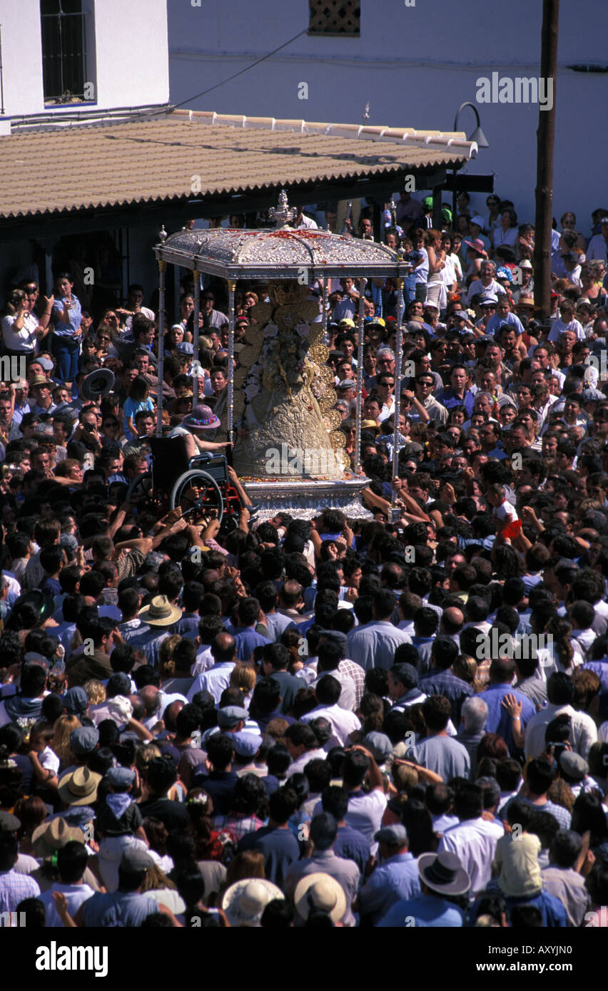El Rocio a woman in a wheelchair is lifted over the crowd to touch the ...