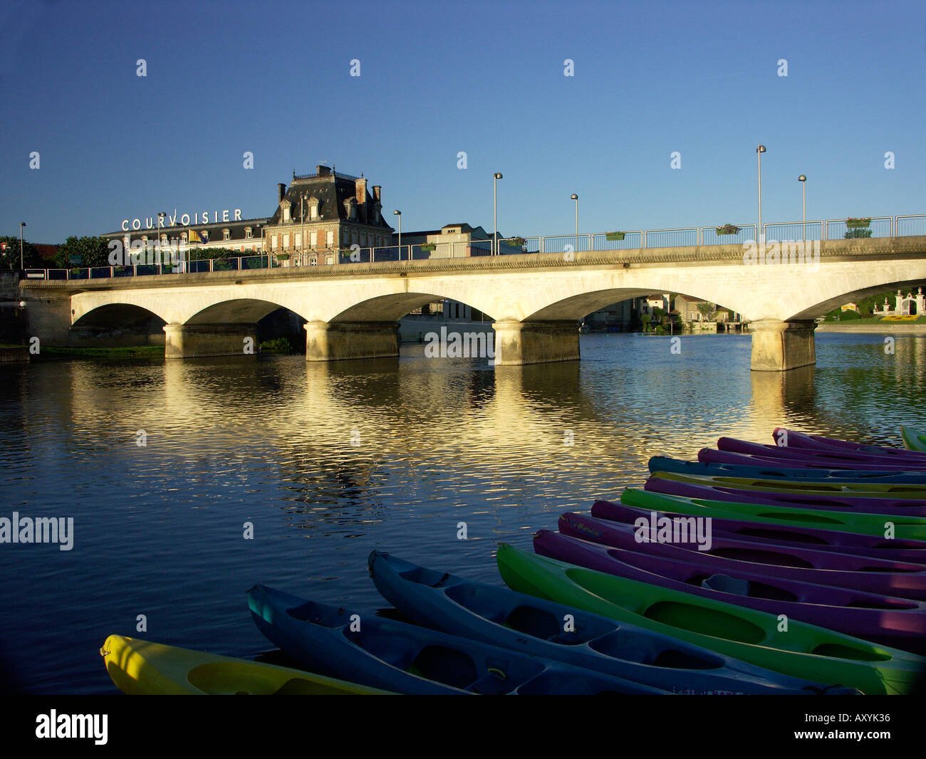 Bridge over the Charente river with Courvoisier Distillery behind ...
