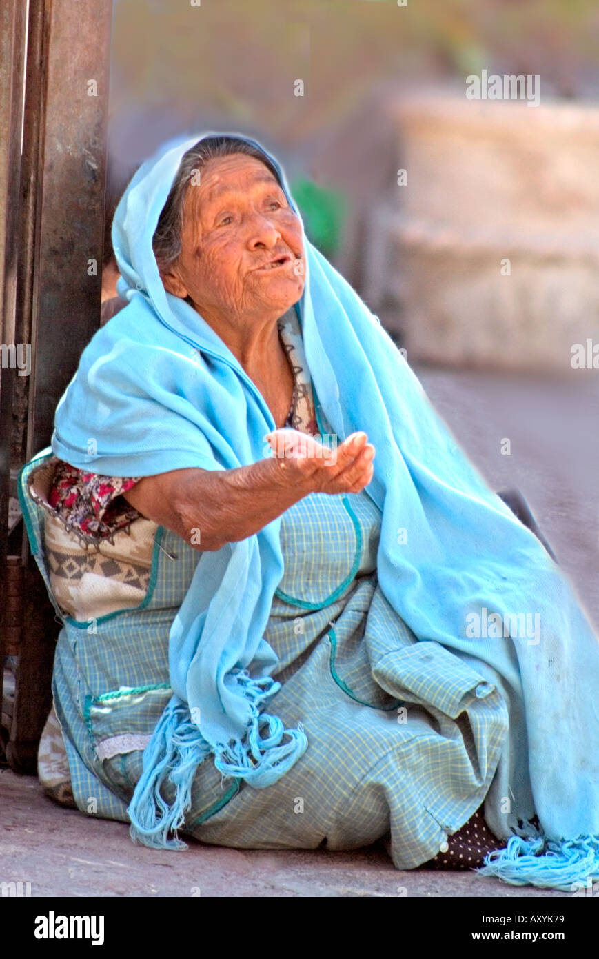 Woman with hand out begging Stock Photo - Alamy