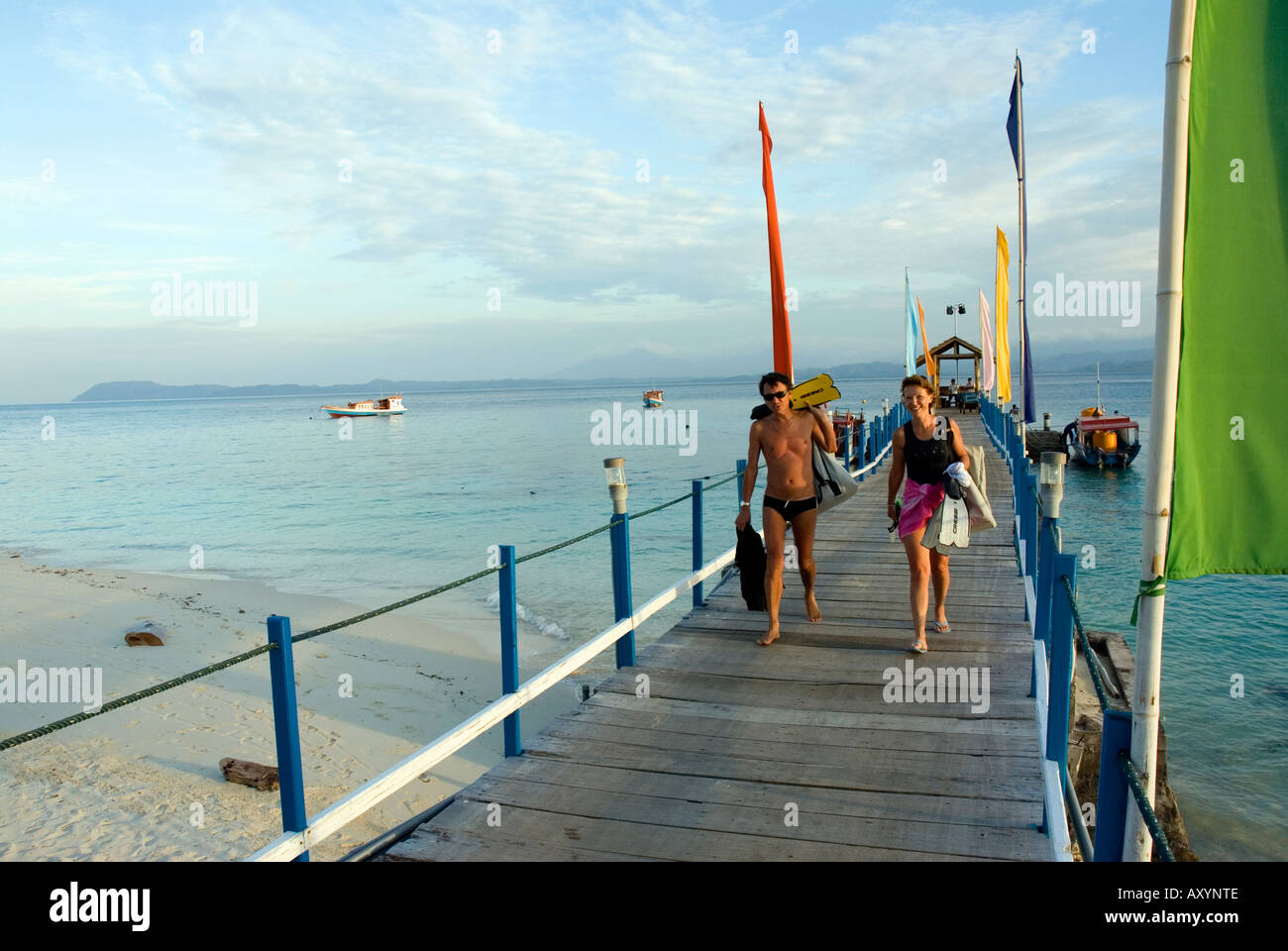 Jetty with colourful banners at Gangga Island dive resort near Manado ...
