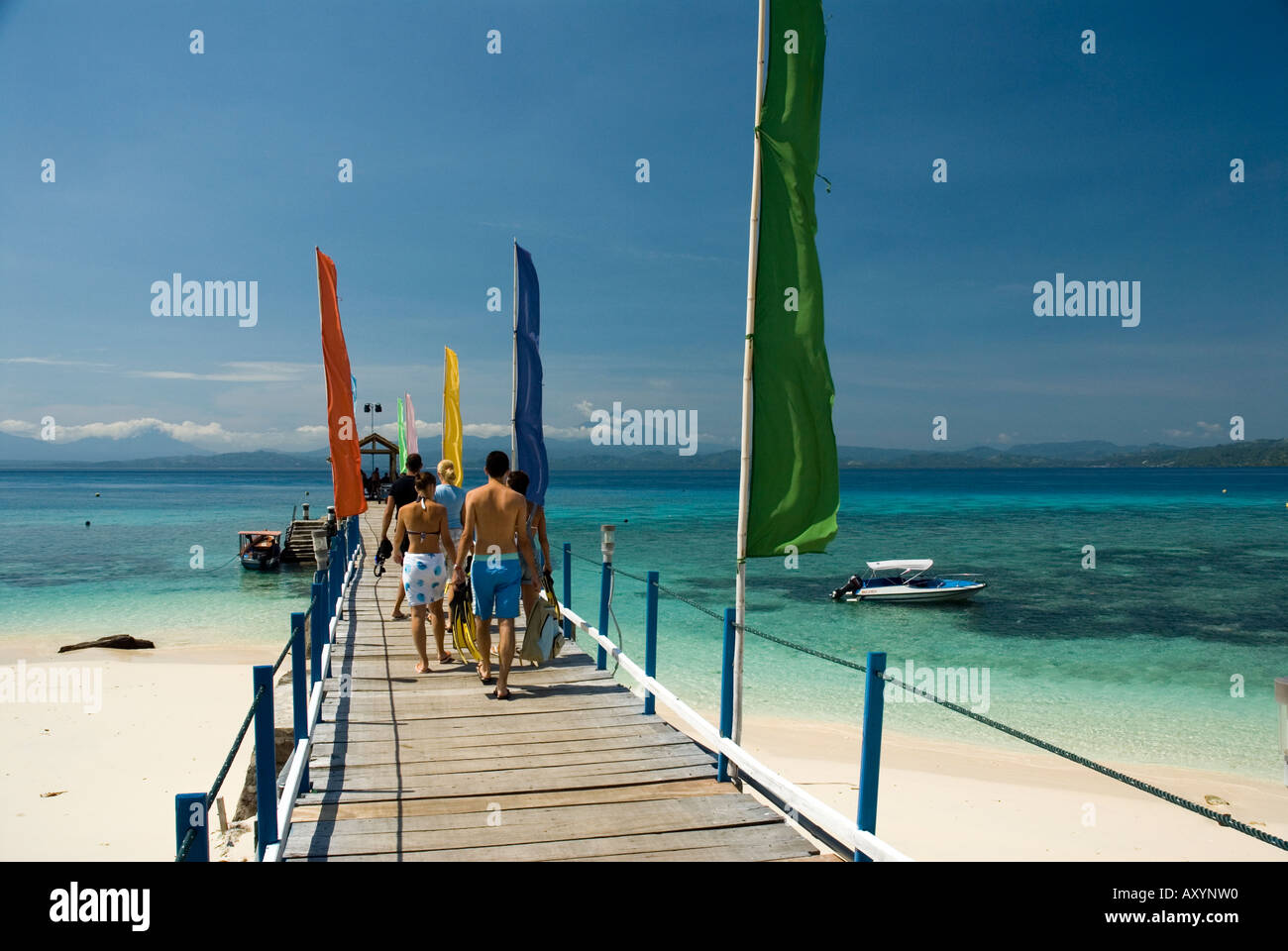 Jetty with colourful banners at Gangga Island dive resort near Manado ...