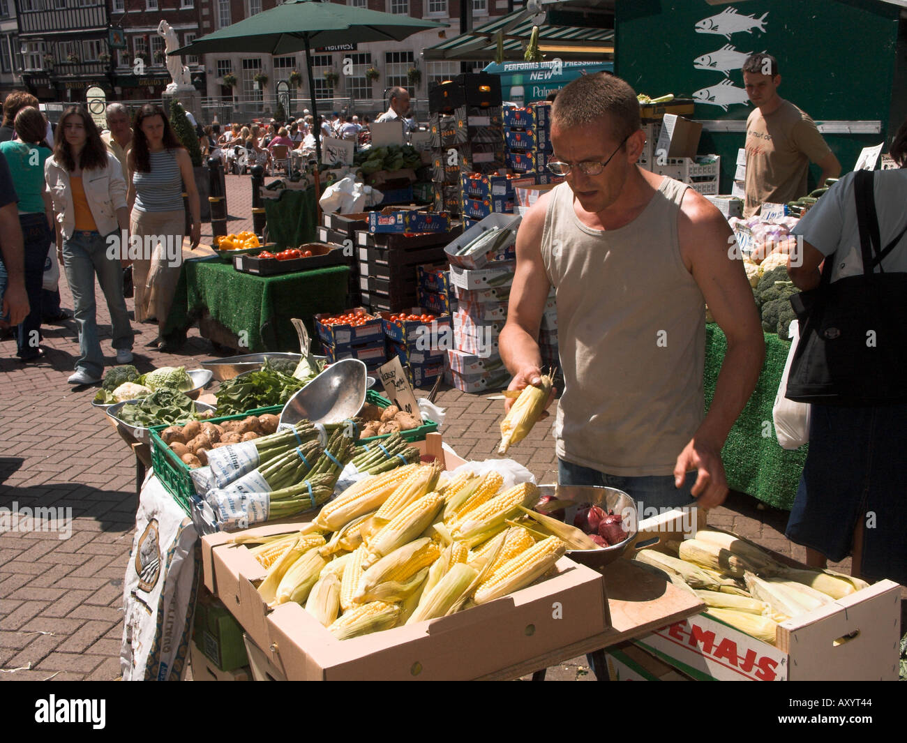 Displaying sweet corn on a fruit and vegetable stall in Kingston market ...