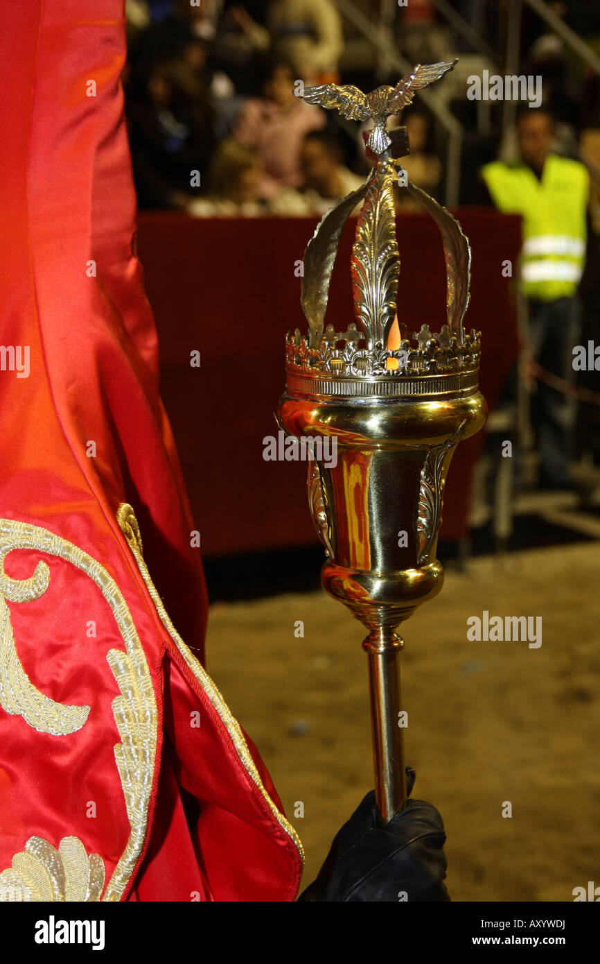 One of the nazarenos of Saint John the Evangelist, wearing red robes ...