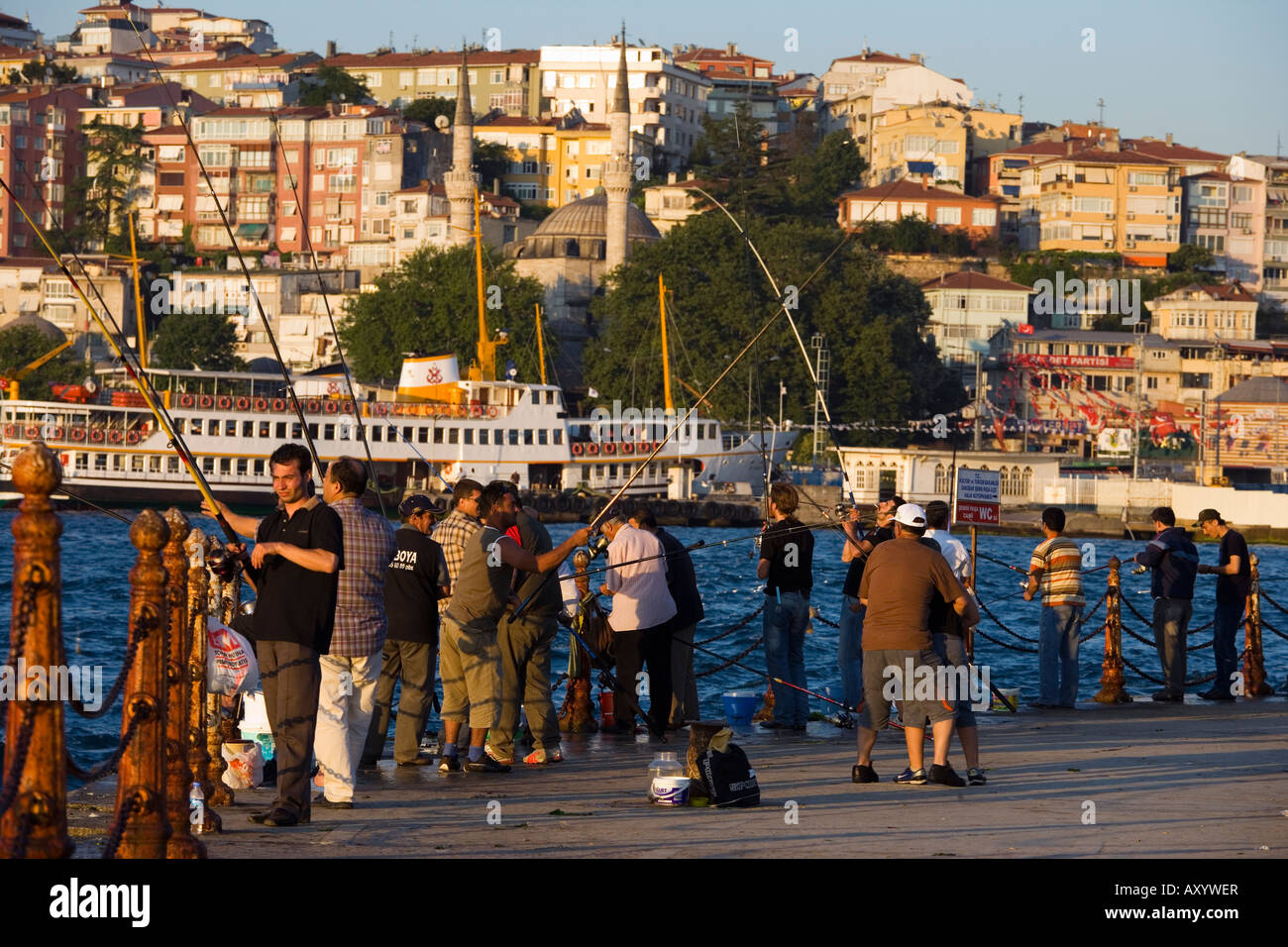 Istanbul, Marmara Region, Turkey; fishermen on the Uskudar, waterfront ...