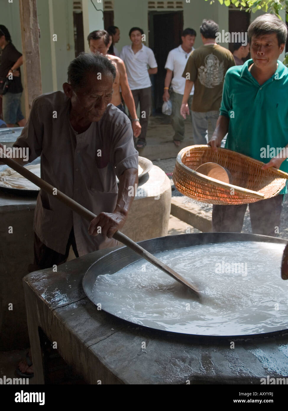 stirring rice at the temple Stock Photo - Alamy