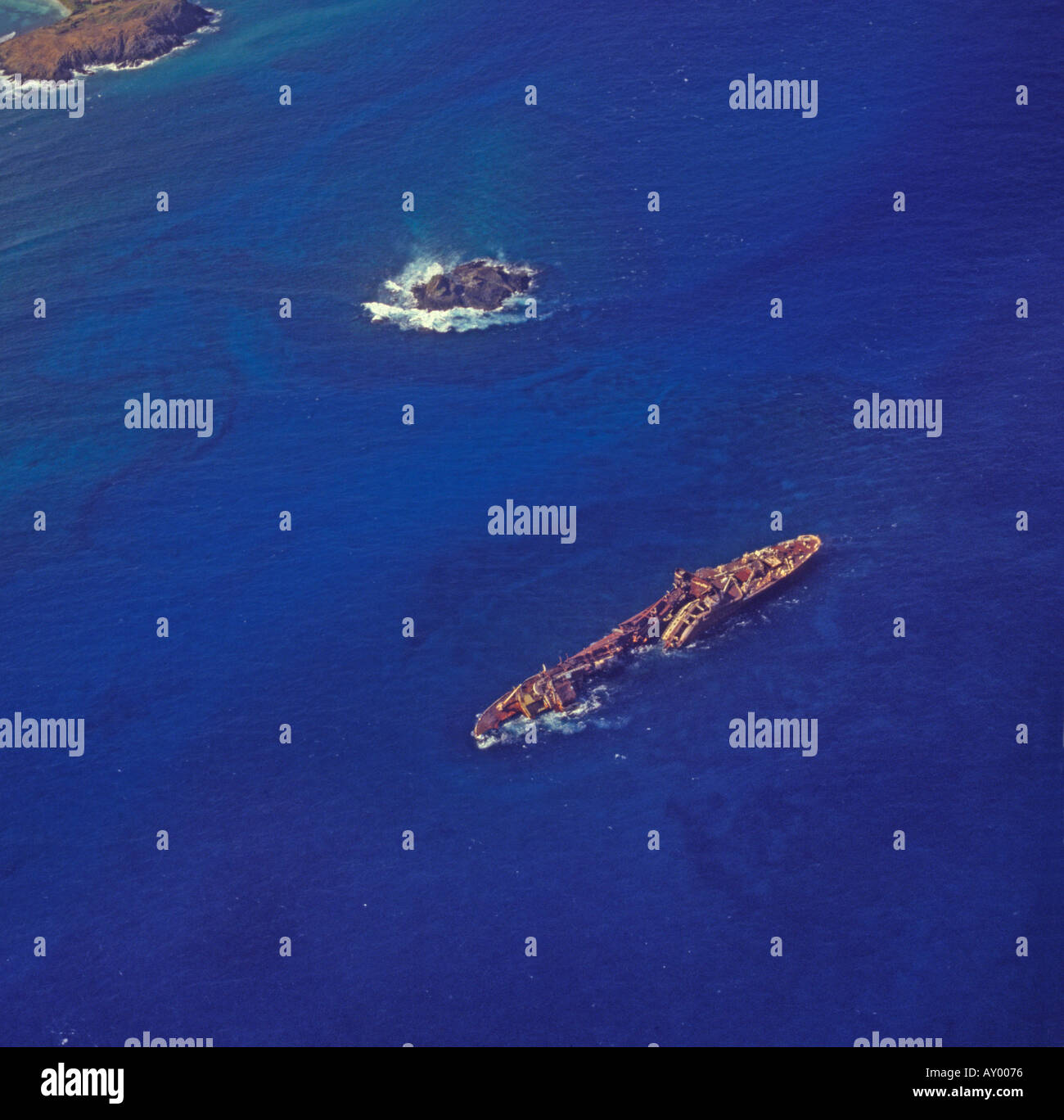 Aerial view over idyllic brilliant blue water off Mustique Island with ...