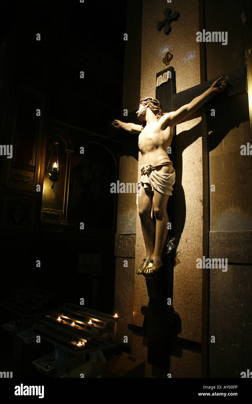 jesus on cross statue in church in rome italy Stock Photo - Alamy