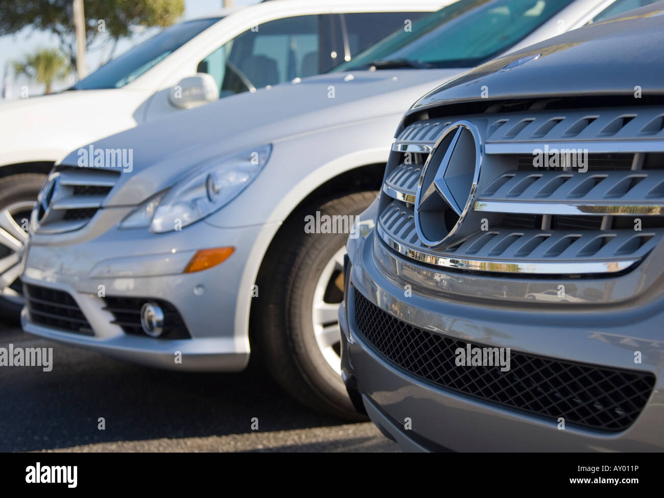 Luxury cars on display at a new car lot Stock Photo - Alamy