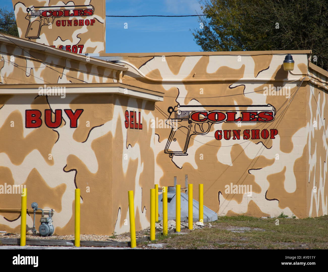 Sign outside a gun shop Stock Photo - Alamy