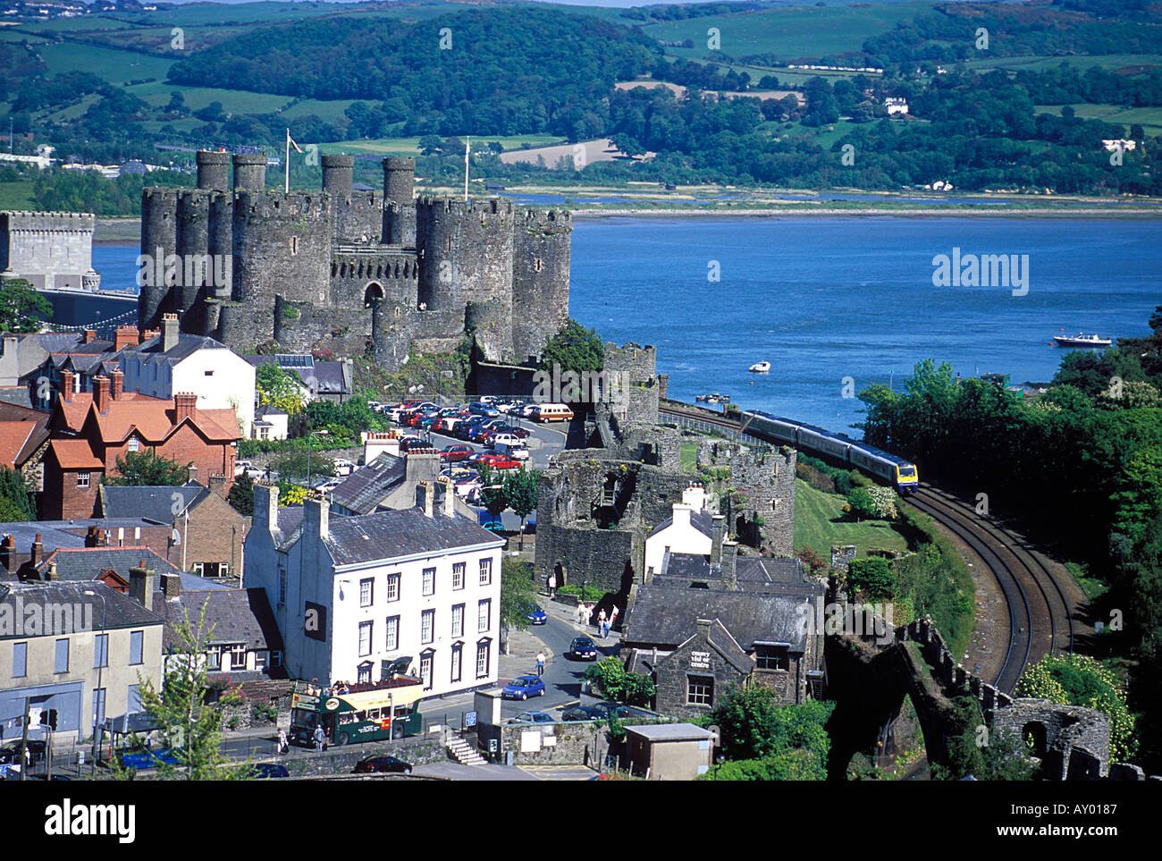 Conwy Castle Wales with a train passing through the town Stock Photo ...