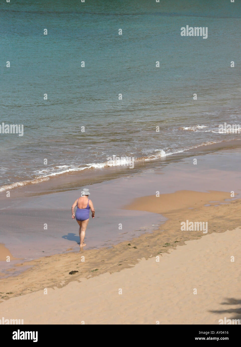 overweight woman powerwalking alone on beach Stock Photo - Alamy
