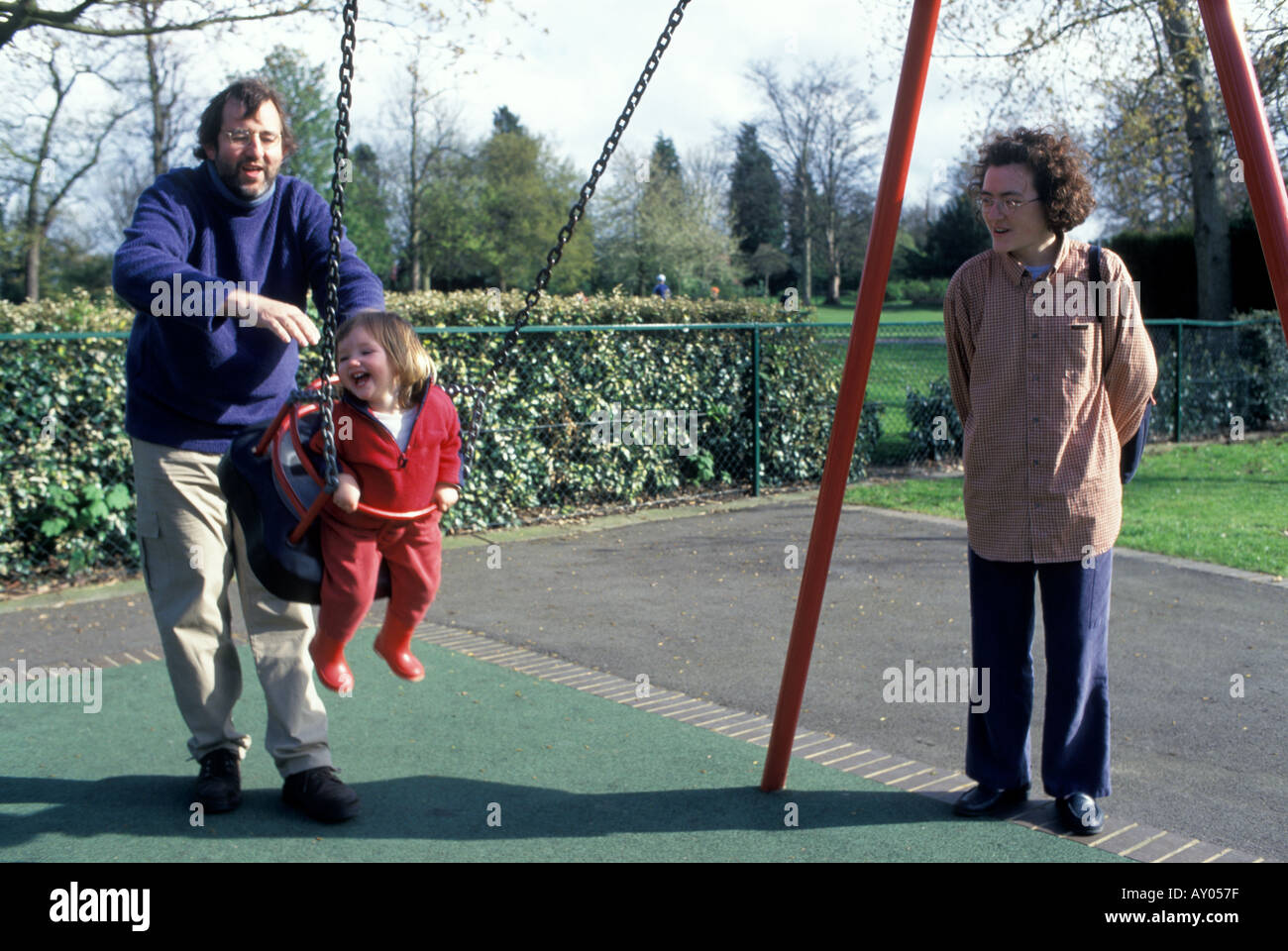 Little girl has exhilarating push on a swing Stock Photo - Alamy