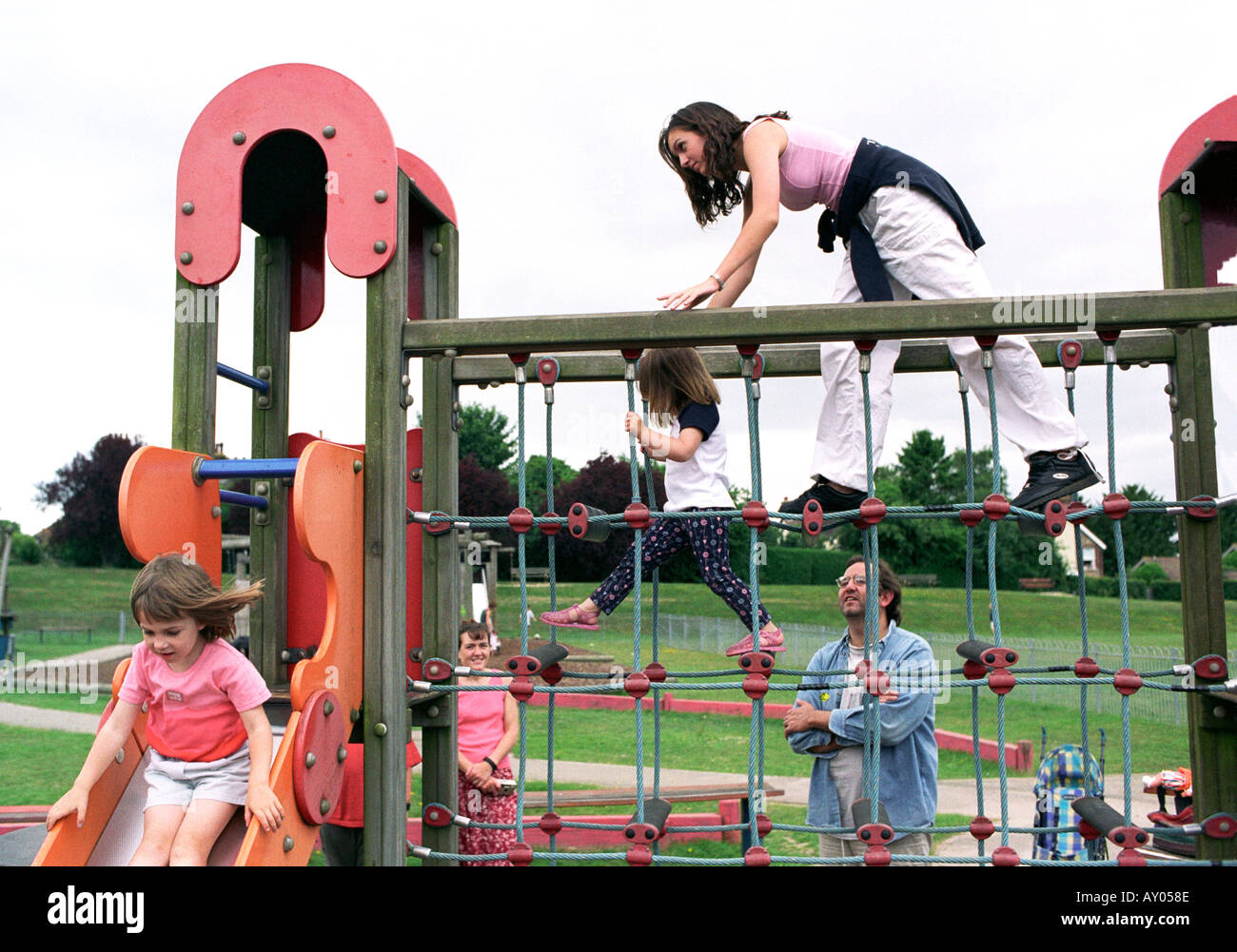 Climbing balancing and sliding Children play on playground apparatus ...