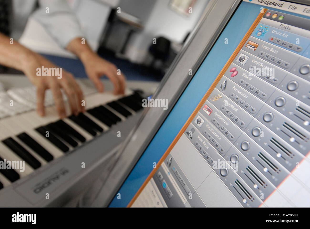 Music technology software on computer screen with keyboard in school ...