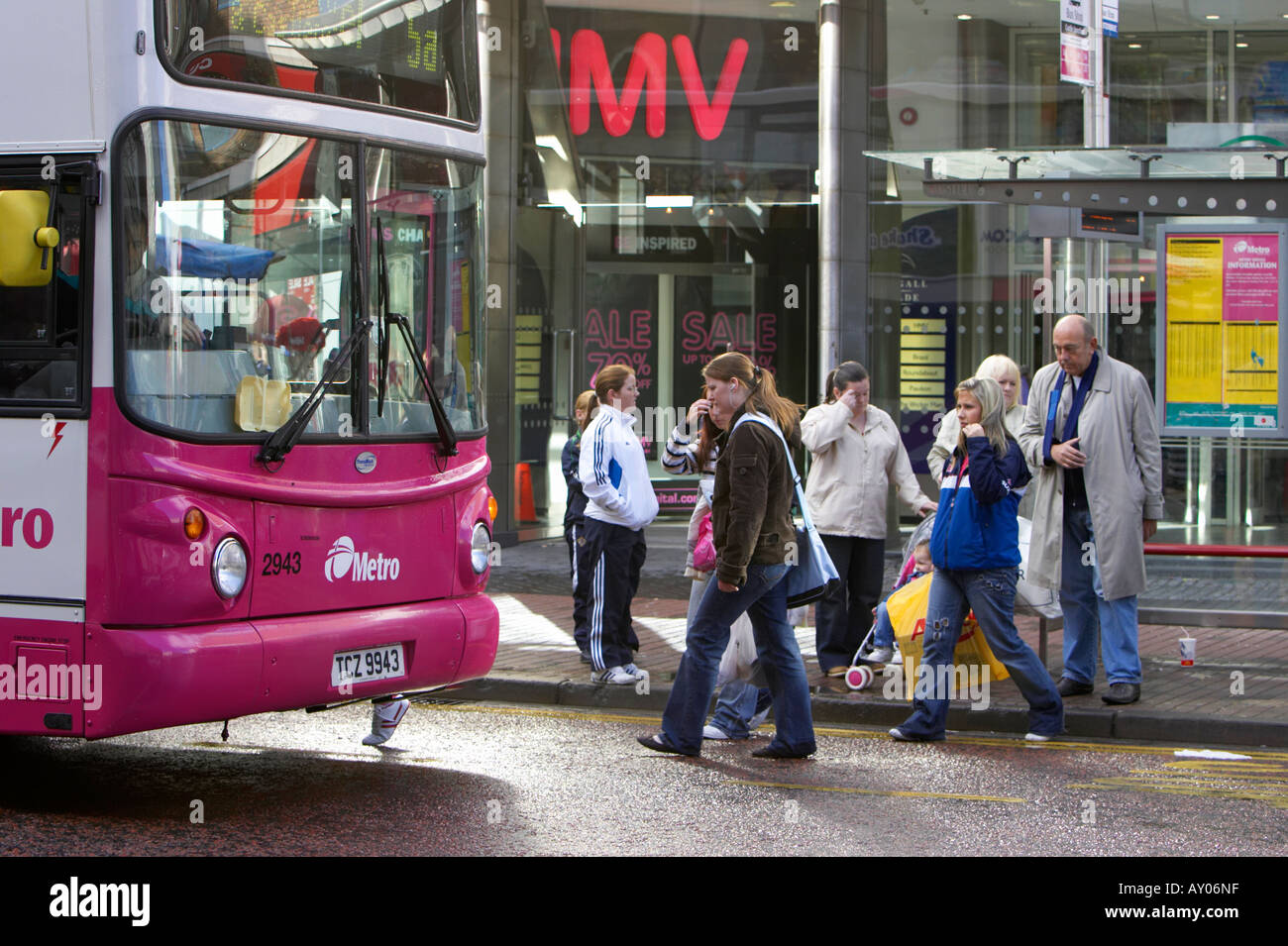 people boarding bus at bus stop in Belfast City Centre Stock Photo - Alamy