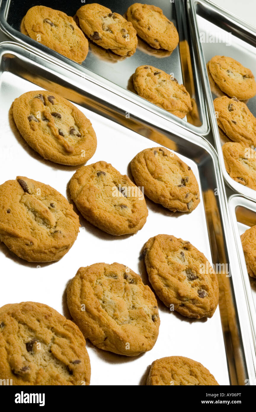 Chocolate chip cookies cooling on trays Stock Photo - Alamy