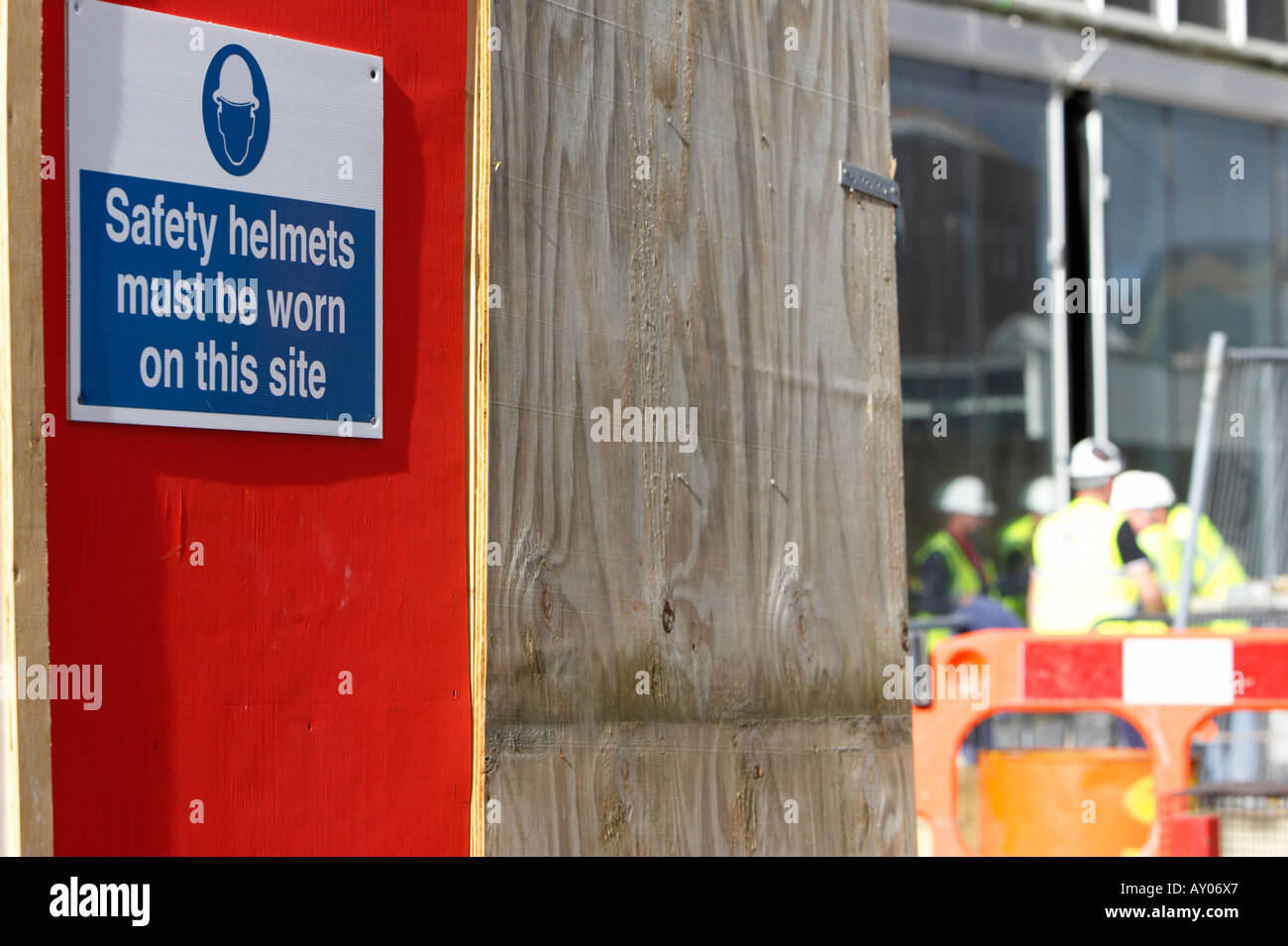 safety helmets must be worn on this site sign with builders in the ...