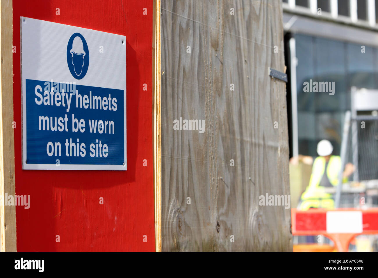 safety helmets must be worn on this site sign with builders in the ...