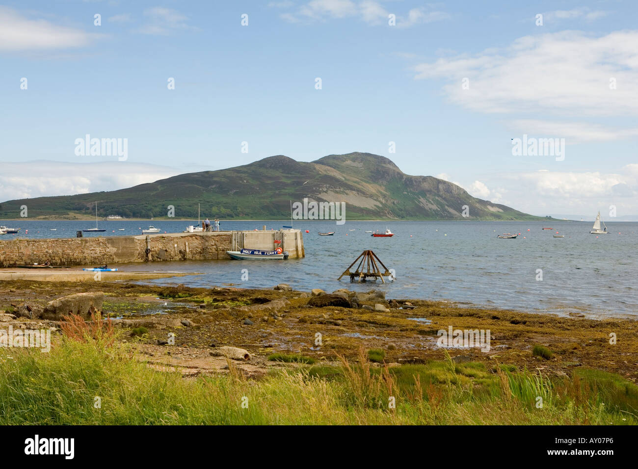 Holy Isle seen from Lamlash beach on the Isle of Arran in Scotland ...