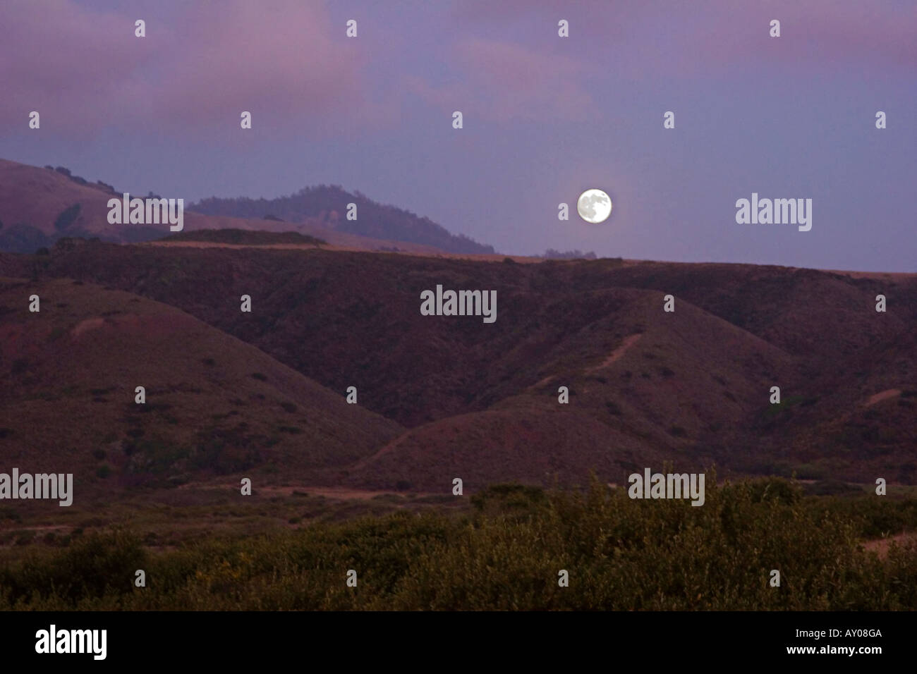 A full moon rises near Point Sierra Nevada just north of San Simeon ...