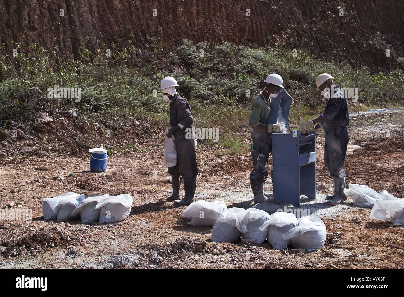 Grade control sampling in surface gold mine opencast pit with geologist ...