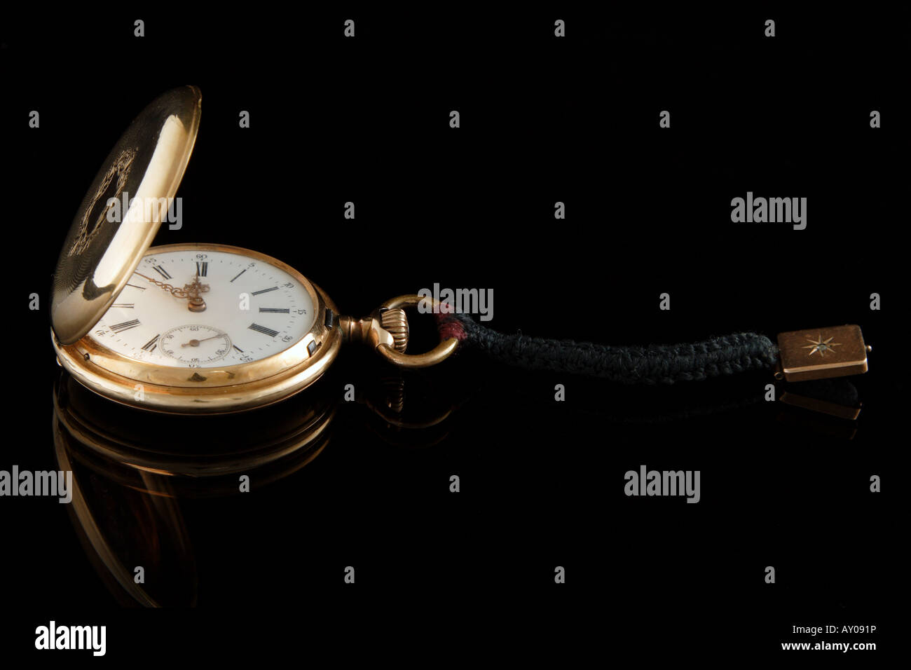 Old golden watch on black background Stock Photo - Alamy