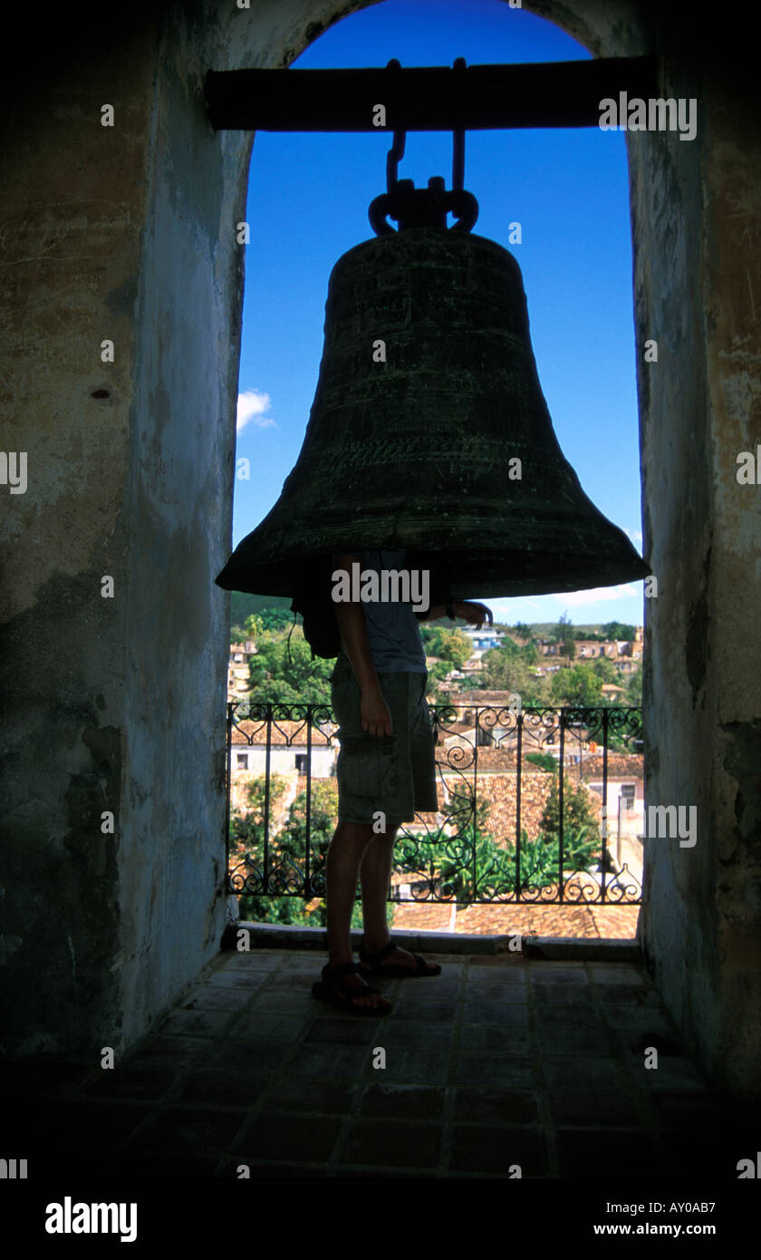 Man standing in huge bell Stock Photo - Alamy